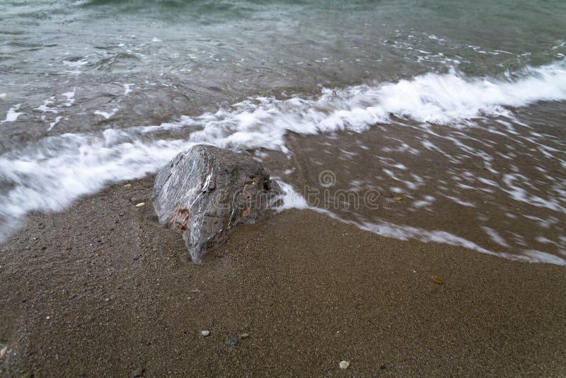 Gloomy sand beach scene stock image. Image of shiny, sandy - 81922123