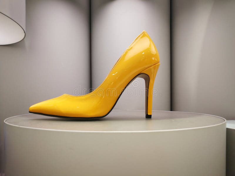 Glossy Yellow High Heel on Display Stock Photo - Image of catwalk ...