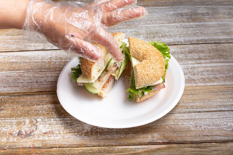 Gloved Hand and Bagel Sandwich Stock Image - Image of plastic, prepare ...