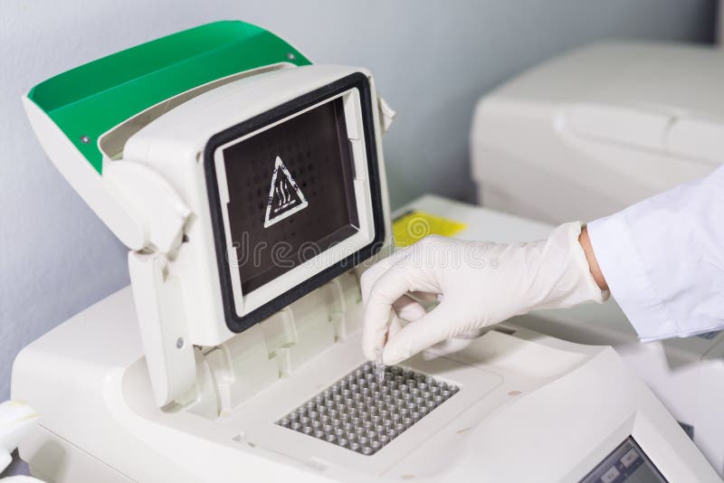 Gloved Hand Entering Sample in Lab Device Stock Photo - Image of ...