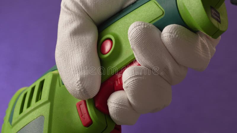 Gloved Hand Gripping Drill Handle and Button. Stock Footage - Video of ...