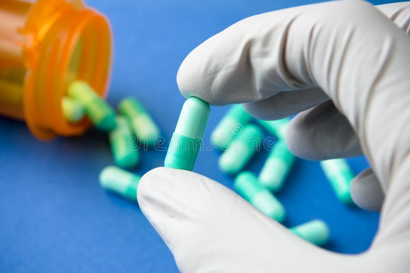 Gloved Hand Holding Prescription Pill Stock Image - Image of horizontal ...