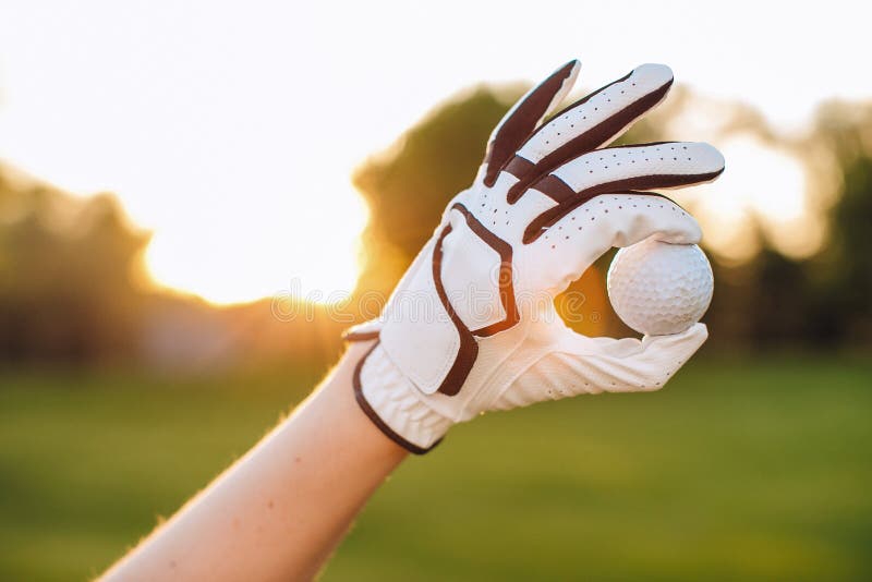 A Gloved Hand Holds a Golf Ball. Golf at the Golf Club Stock Image ...