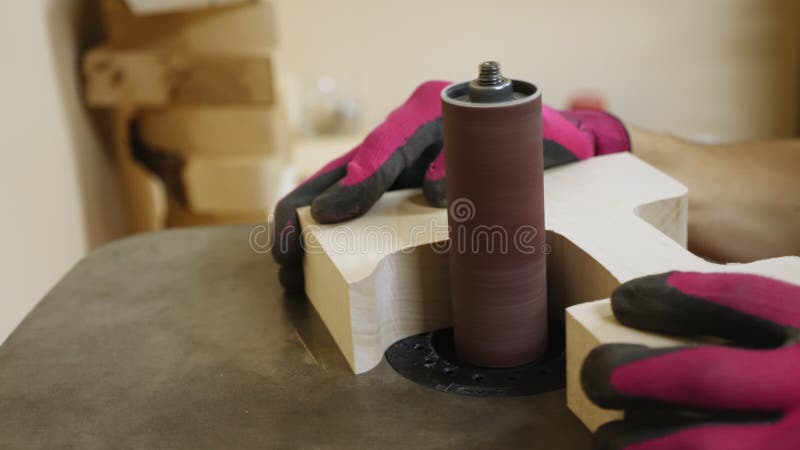 A Gloved Hand Works with a Wooden Blank on a Sanding Machine Stock ...