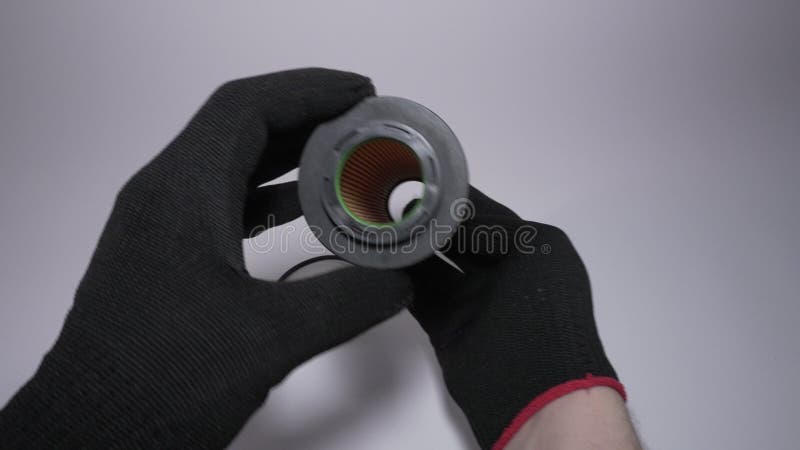 Hands Holding a Cylindrical Object with Protective Gloves for Safety ...