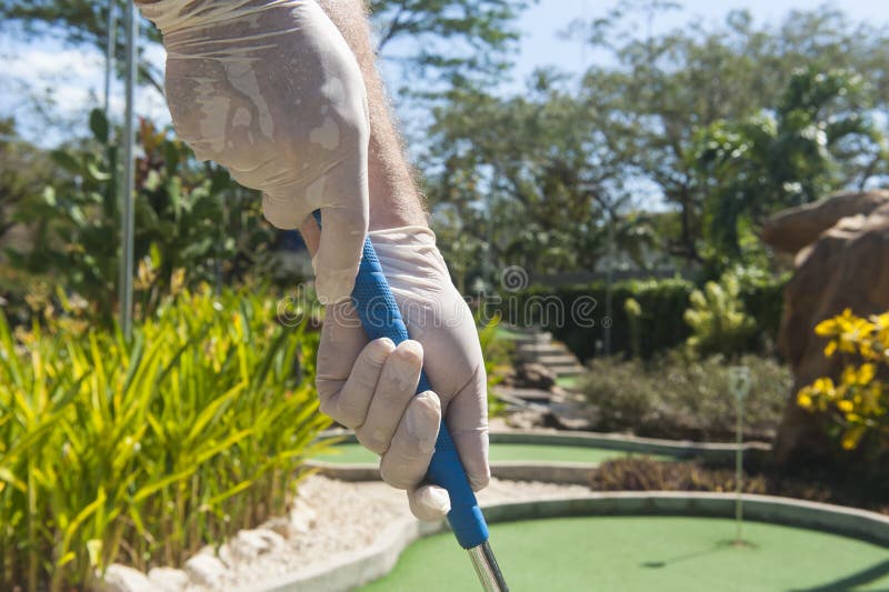 Gloved Hands Holding Mini Golf Club Stock Photo - Image of golf ...