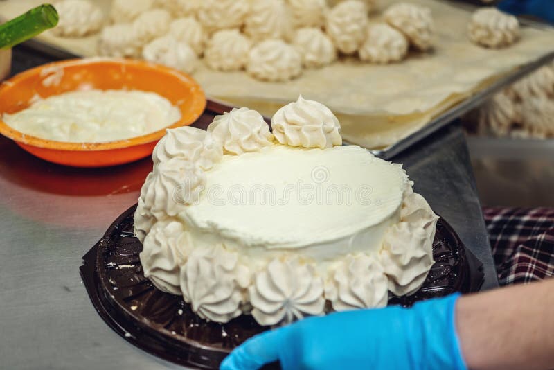 Gloved Hands in Process of Making Meringue Cake and Desserts ...