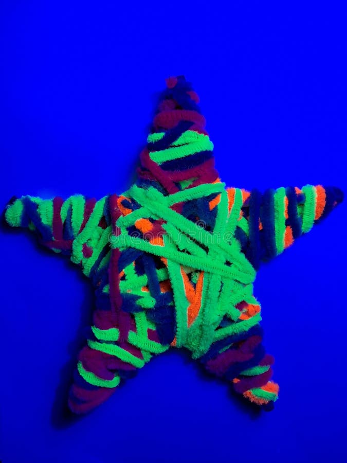 Glow in the Dark Neon Star Under a Black Light Stock Image - Image of ...