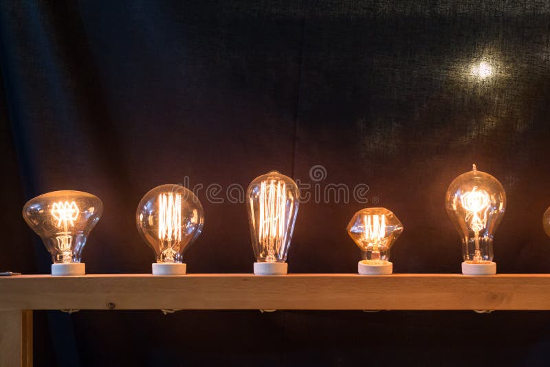 Glow Yellow Design Light Bulbs in Black Stock Image - Image of glass ...