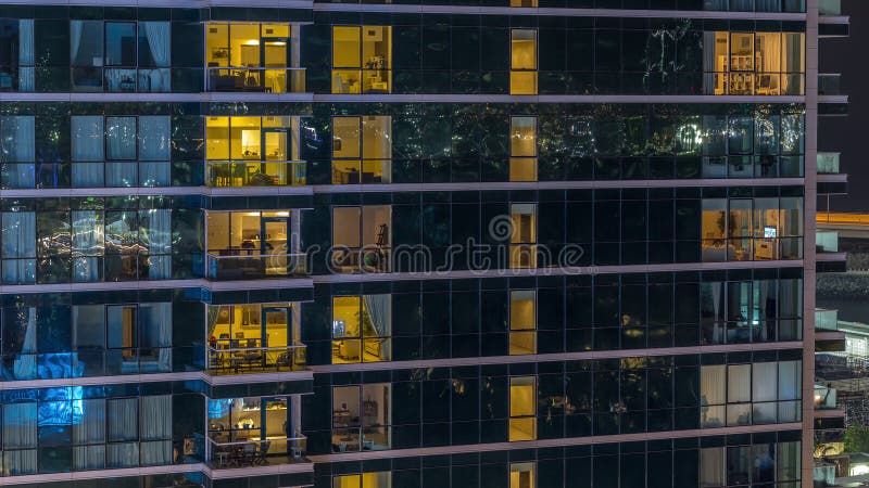 Glowing Apartment Windows at Night in Glass Skyscraper Timelapse Stock ...