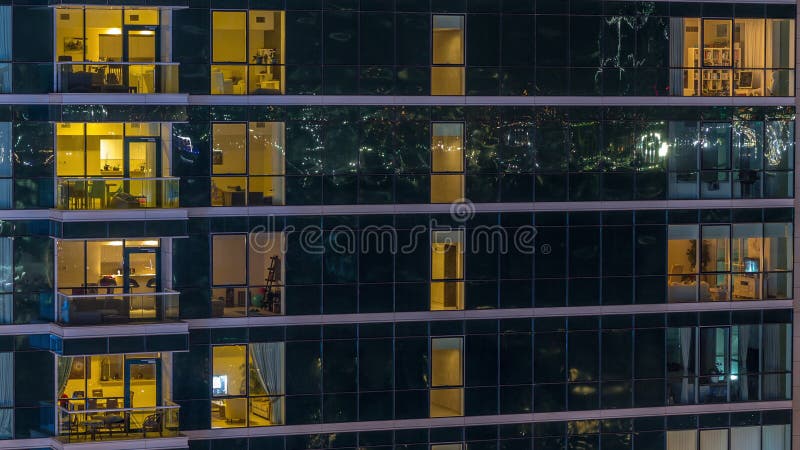 Glowing Apartment Windows at Night in Glass Skyscraper Timelapse Stock ...