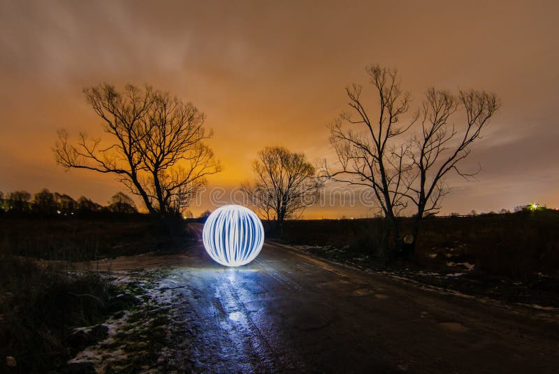 Glowing Ball on Spring Road between Two Trees Stock Image - Image of ...