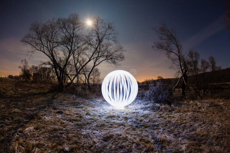 Glowing Ball between the Trees on the Bank of the River Stock Photo ...
