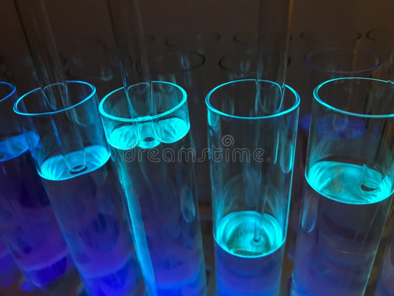 Glowing Blue Luminescent Solutions in Chemical Test Tubes Stock Image ...
