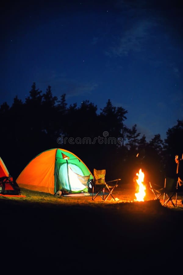 Glowing Camping Tent Near Bonfire in Wilderness Stock Image - Image of ...