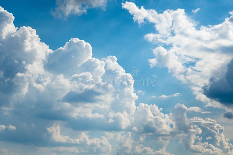 Glowing Clouds on a Background of Blue Sky. White Fluffy Luminous Cloud ...