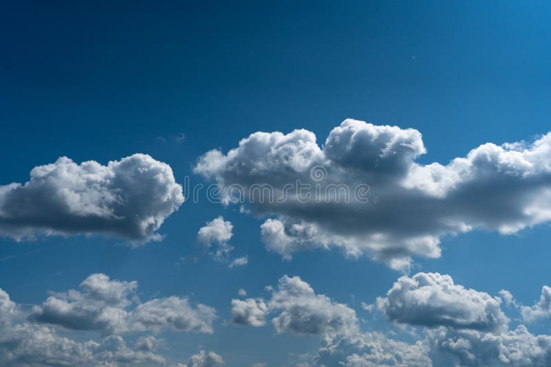 Glowing Clouds on a Background of Blue Sky. White Fluffy Luminous Cloud ...