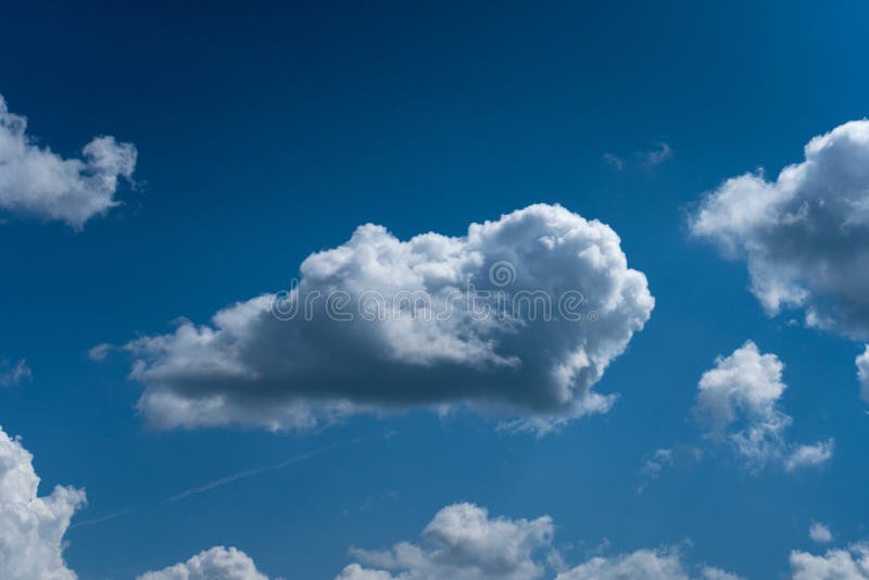 Glowing Clouds on a Background of Blue Sky. White Fluffy Luminous Cloud ...