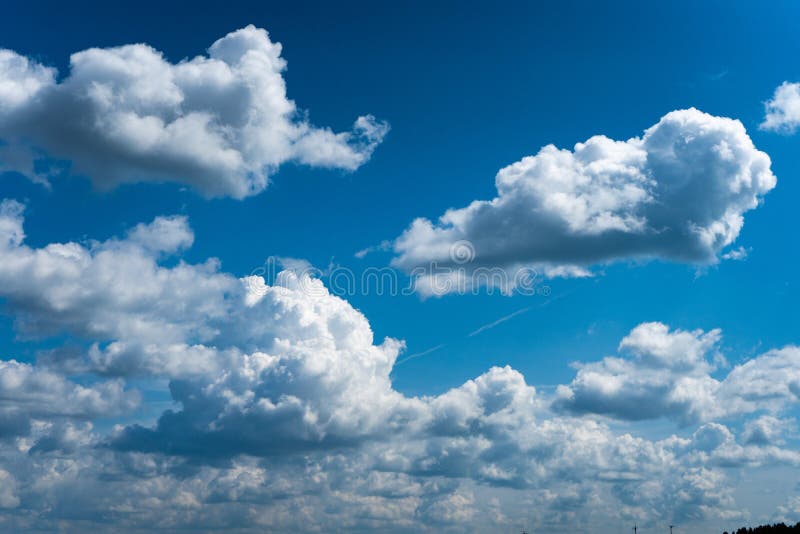 Glowing Clouds on a Background of Blue Sky. White Fluffy Luminous Cloud ...