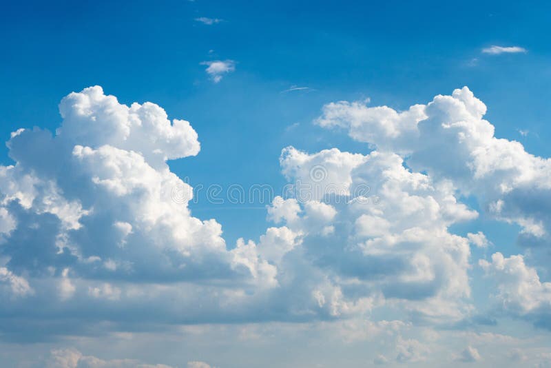 Glowing Clouds on a Background of Blue Sky. White Fluffy Luminous Cloud ...