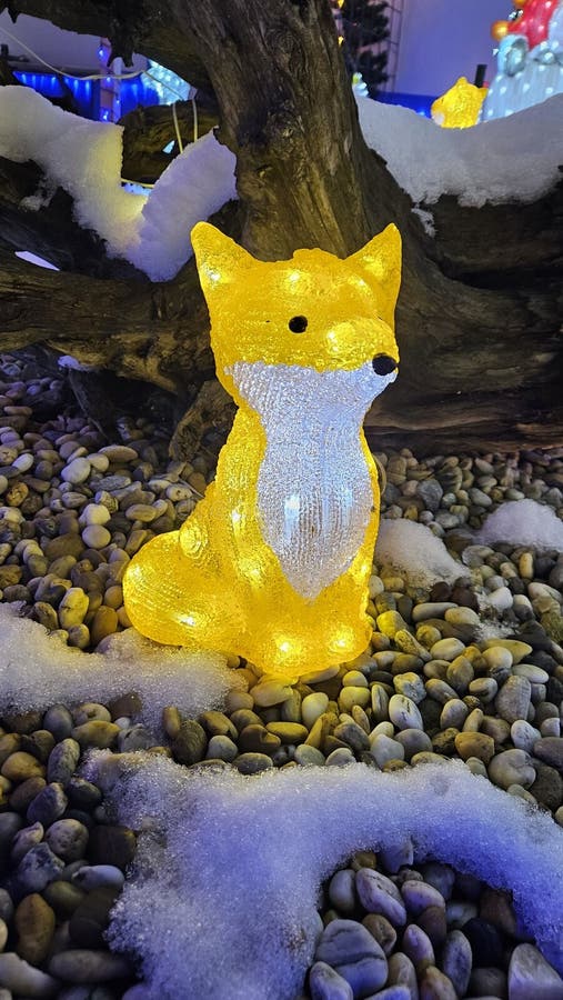 A Glowing, Decorative Fox Figure, Featuring a Bright Orange and White ...
