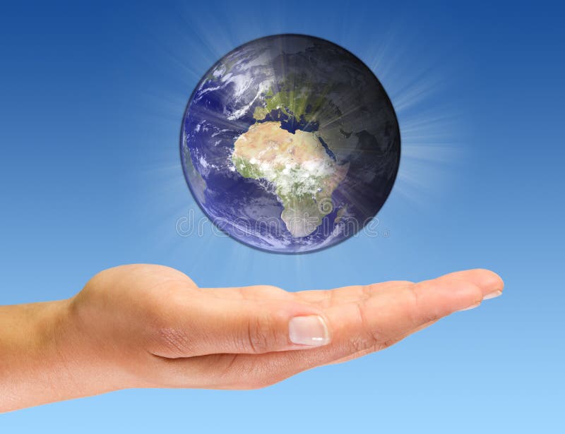 Glowing Earth on open palm stock photo. Image of gesture - 15288920