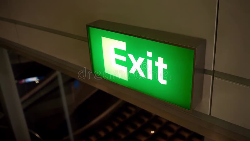 Green Exit Sign Glowing in Dark Building Stock Footage - Video of ...
