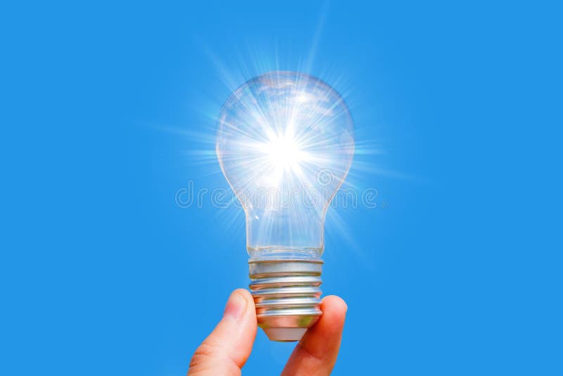 Glowing Empty Light Bulb in Hand Isolated on Blue Stock Photo - Image ...