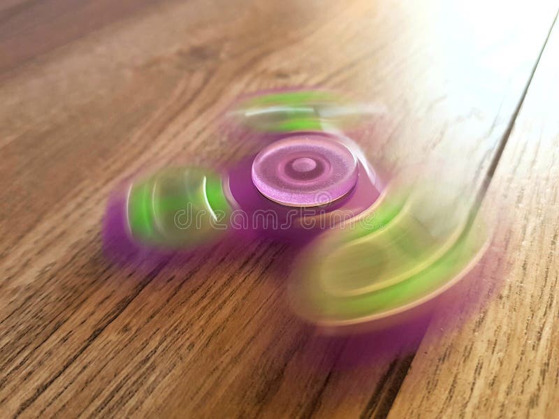 Glowing Fidget Spinner stock photo. Image of skill, hand - 94160098