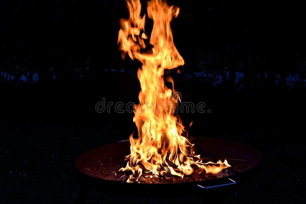 Glowing fire on disc grill stock image. Image of smoke - 259700657