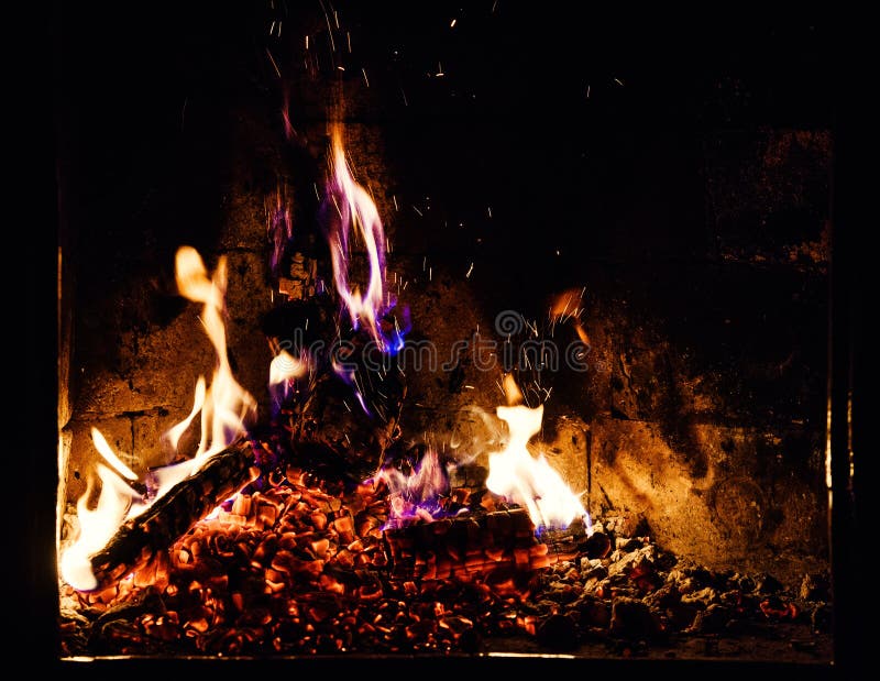 A Glowing Fire in the Stone Fireplace Stock Image - Image of fireside ...
