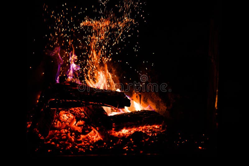 A Glowing Fire in the Stone Fireplace Stock Image - Image of living ...