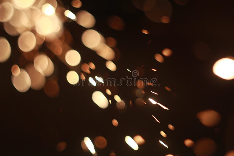 Glowing Flow of Sparks in the Dark. Fire Sparks on a Dark Background ...