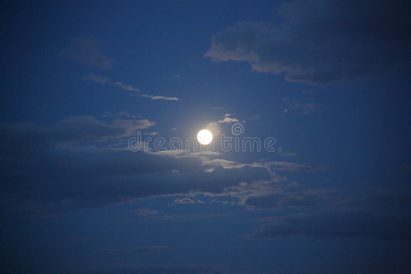 Glowing Full Moon Up in the Cloudy Sky Stock Image - Image of moon ...