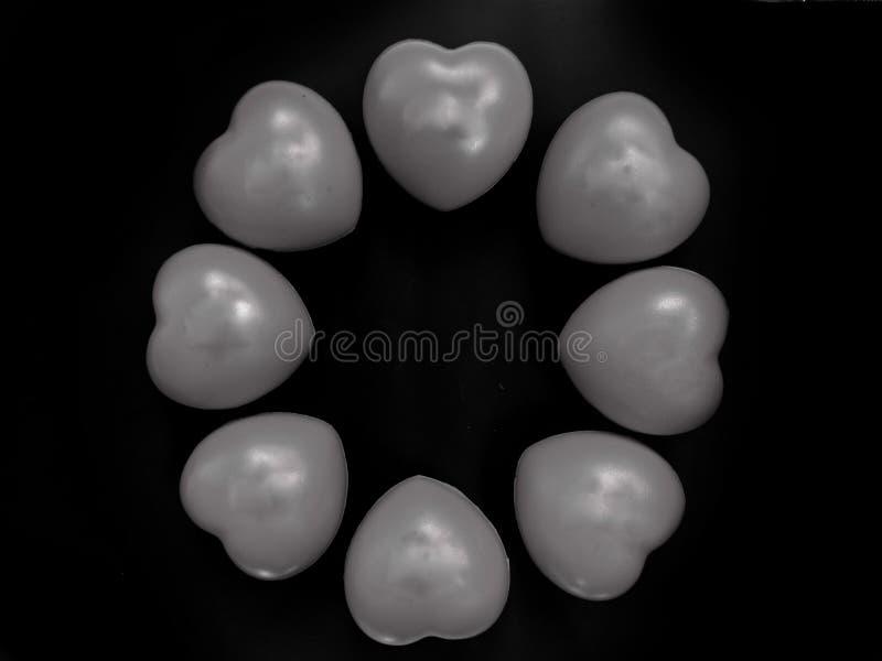 Glowing Gray Hearts Arranged in a Circle Shape Isolated on a Black ...