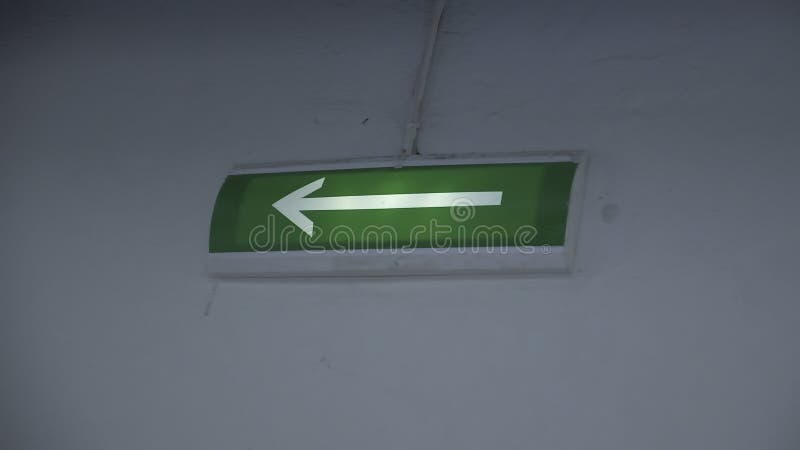 Glowing Green Arrow on Wall. Clip. Arrow on Green Background Lights Up ...