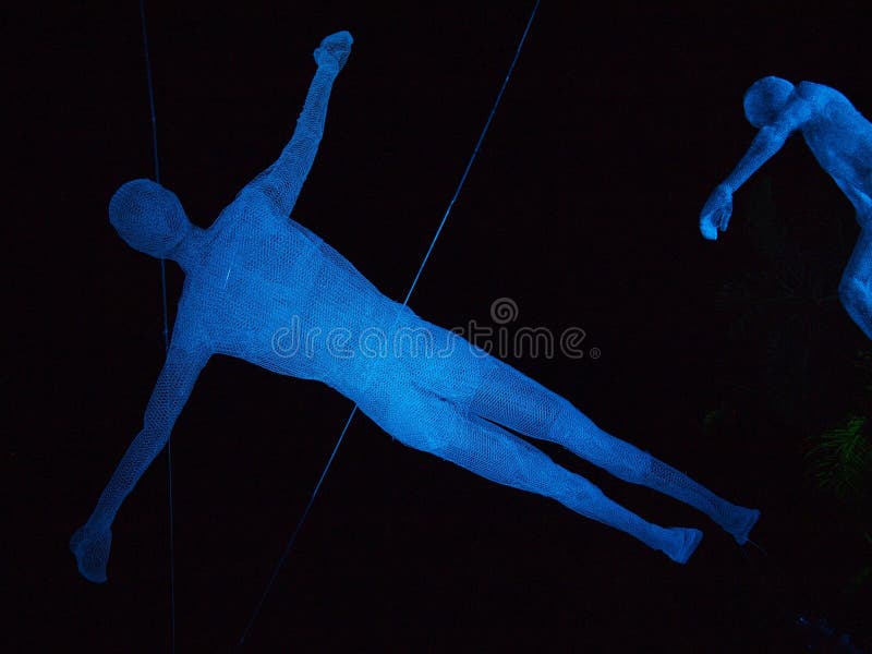 Glowing Humanoid Figures Hanging in the Dark Stock Image - Image of ...