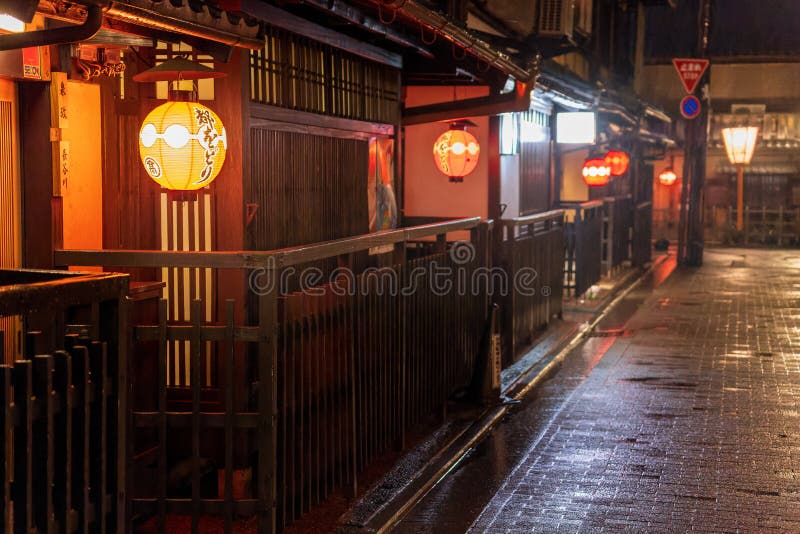 Glowing Lanterns in Front of Small Shops at Night Stock Photo - Image ...