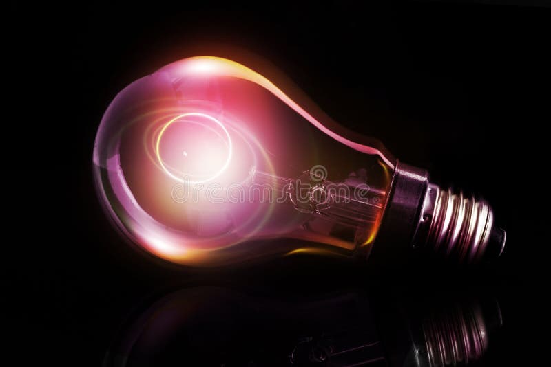 Glowing light bulb stock photo. Image of light, dark - 255407690