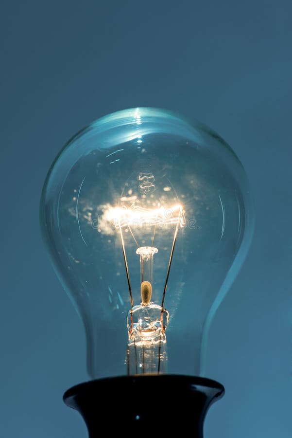 Glowing light bulb stock photo. Image of invention, heat - 45728276