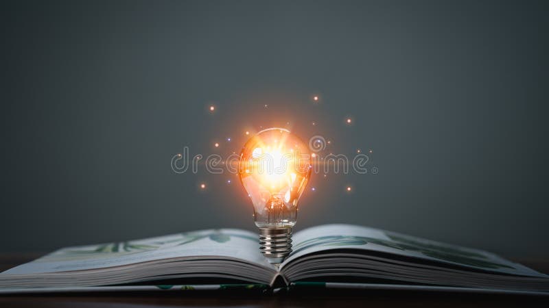 Glowing Light Bulb with Creativity Twinkling Lights on a Book. Ideas ...