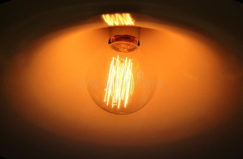 Glowing light bulb stock photo. Image of tungsten, edison - 48517280