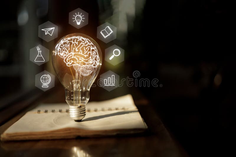 A Glowing Light Bulb with an Icon is Placed on the Book. Stock Photo ...