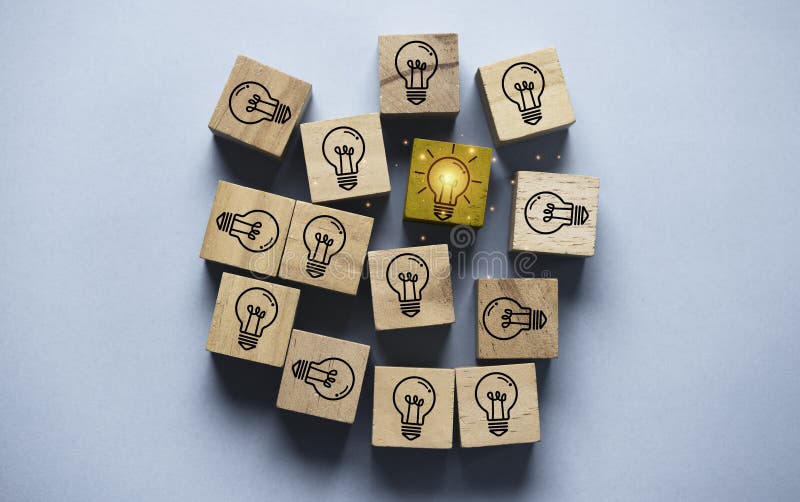 Glowing Light Bulb among Normal Lamp for Focus and Concentrate of ...