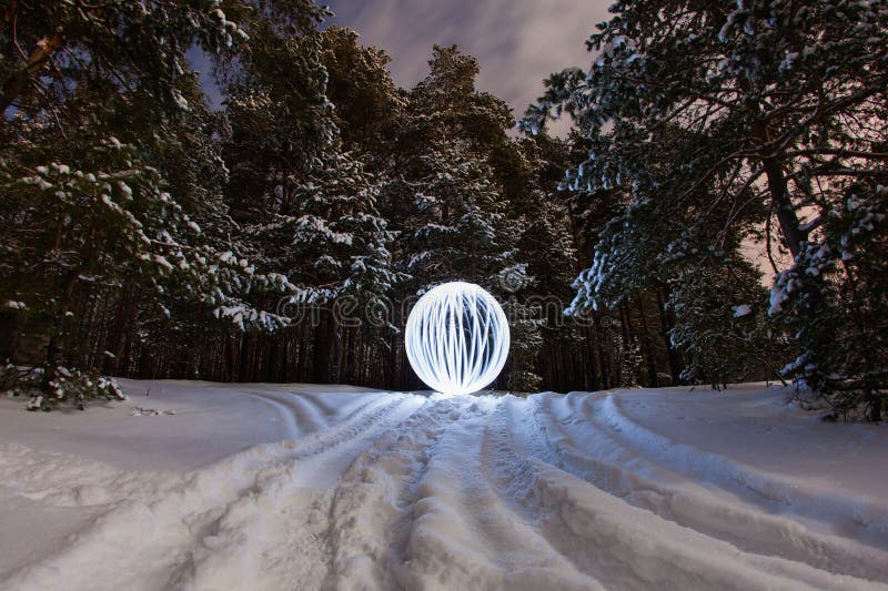 Glowing Orb in the Winter Pine Forest Stock Image - Image of plate ...