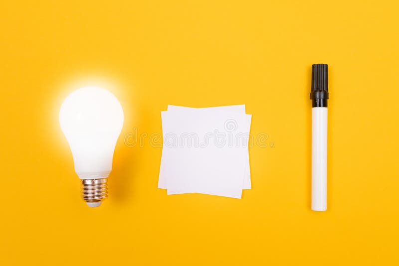 Glowing Power Saving Lamp with White Note Paper Stock Photo - Image of ...