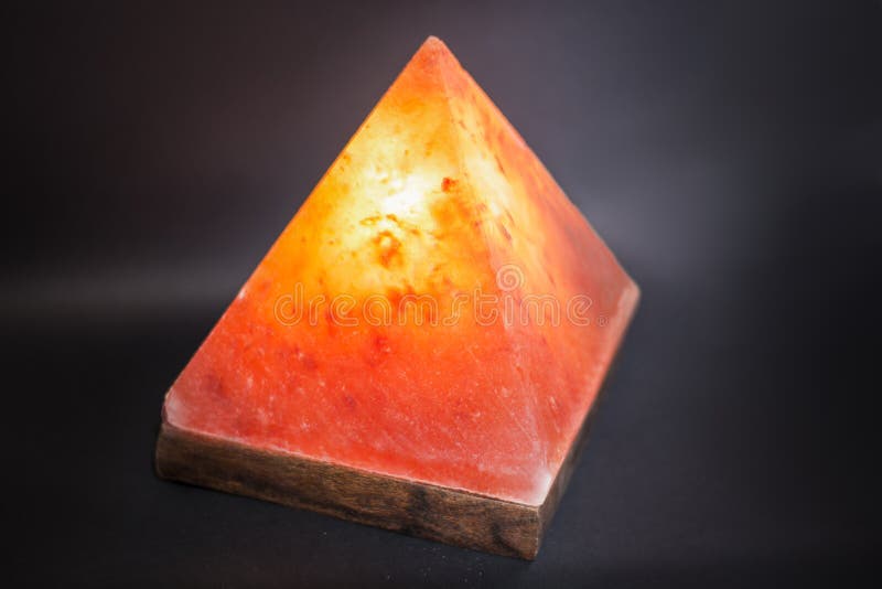 Glowing Pyramid of Red Salt Lamp Stock Photo - Image of equipment ...