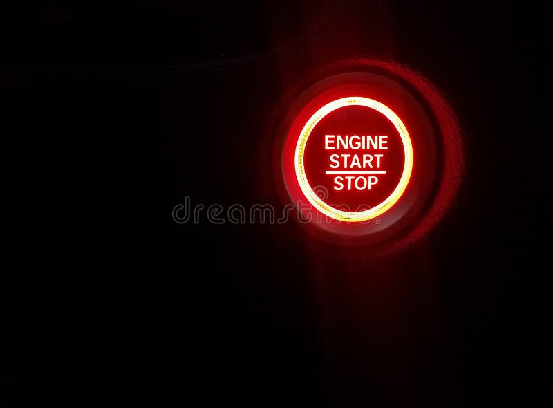 Glowing Red Engine Start Stop Light and Black Background Stock Photo ...