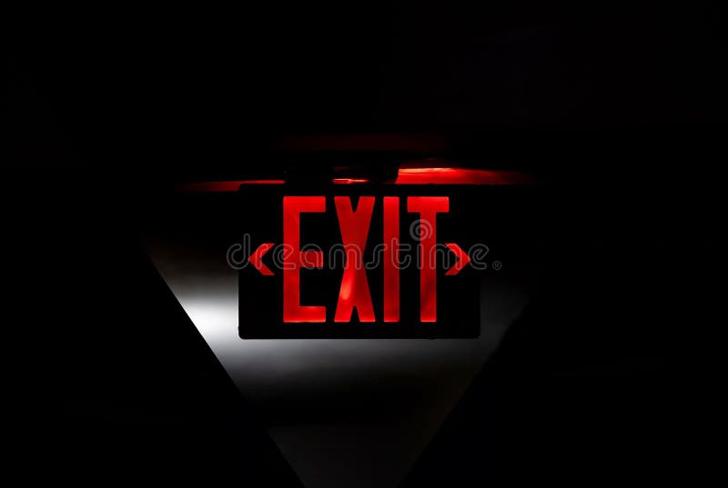 Glowing Red Exit Sign in a Dark Setting, Illuminated with Subtle Light ...