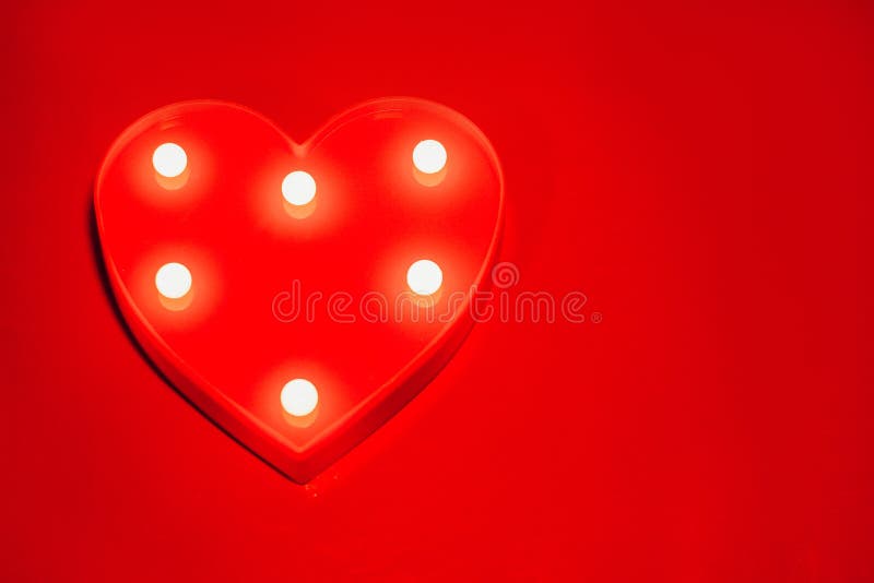 Glowing Red Heart with Flashlights on the Red Background Closeupr Stock ...